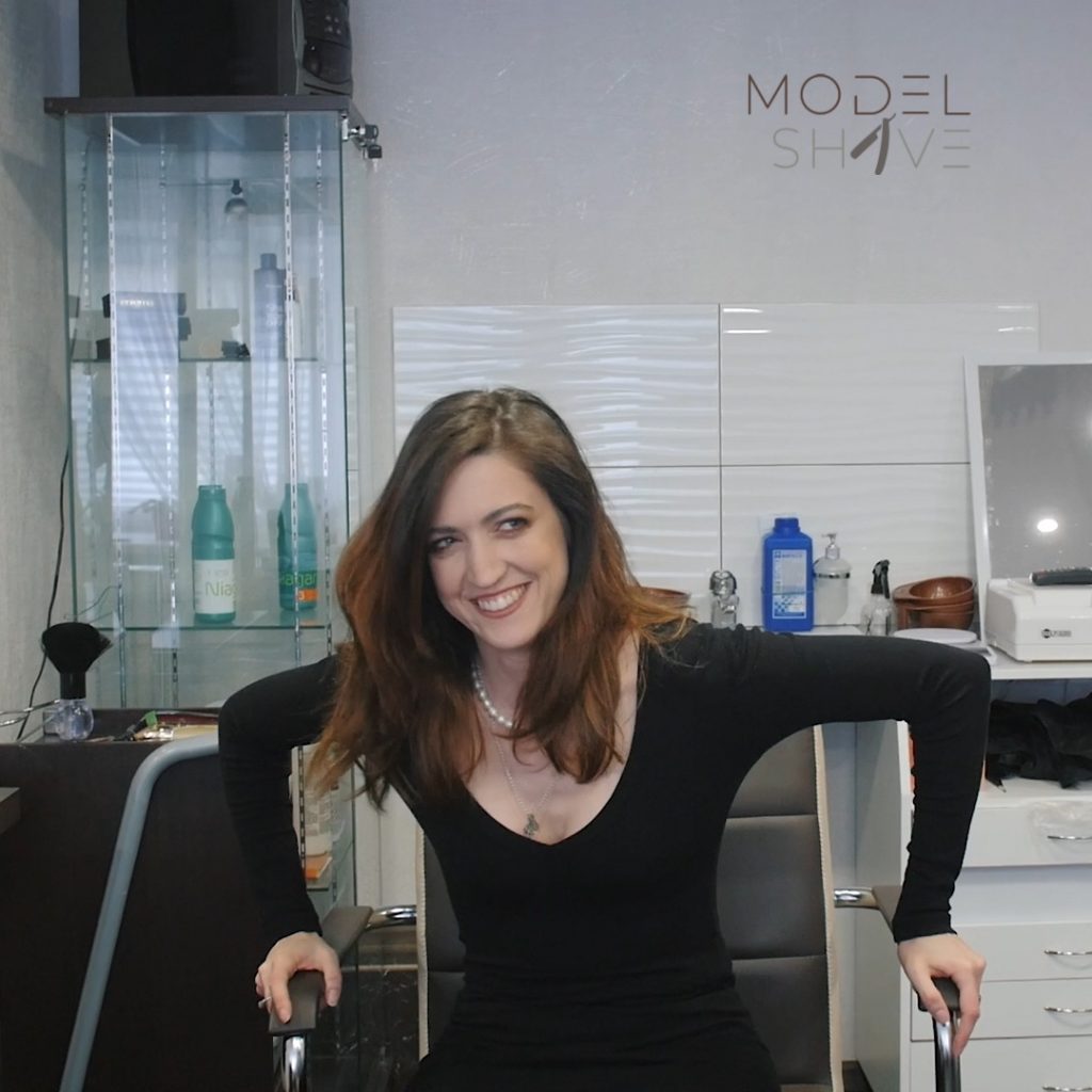 Woman at the barbershop to make a smooth shiny headshave. - Model Shave