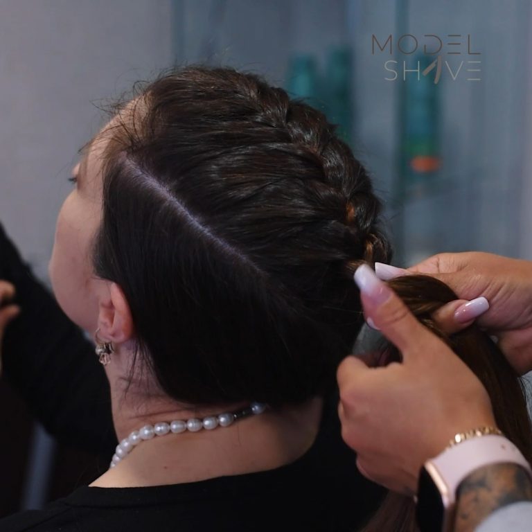 Woman at the barbershop to make a smooth shiny headshave. - Model Shave