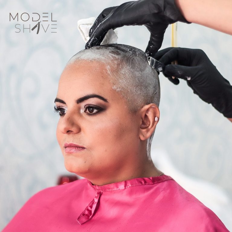 Brunette woman gets a full head shave from our barberette. - Model Shave