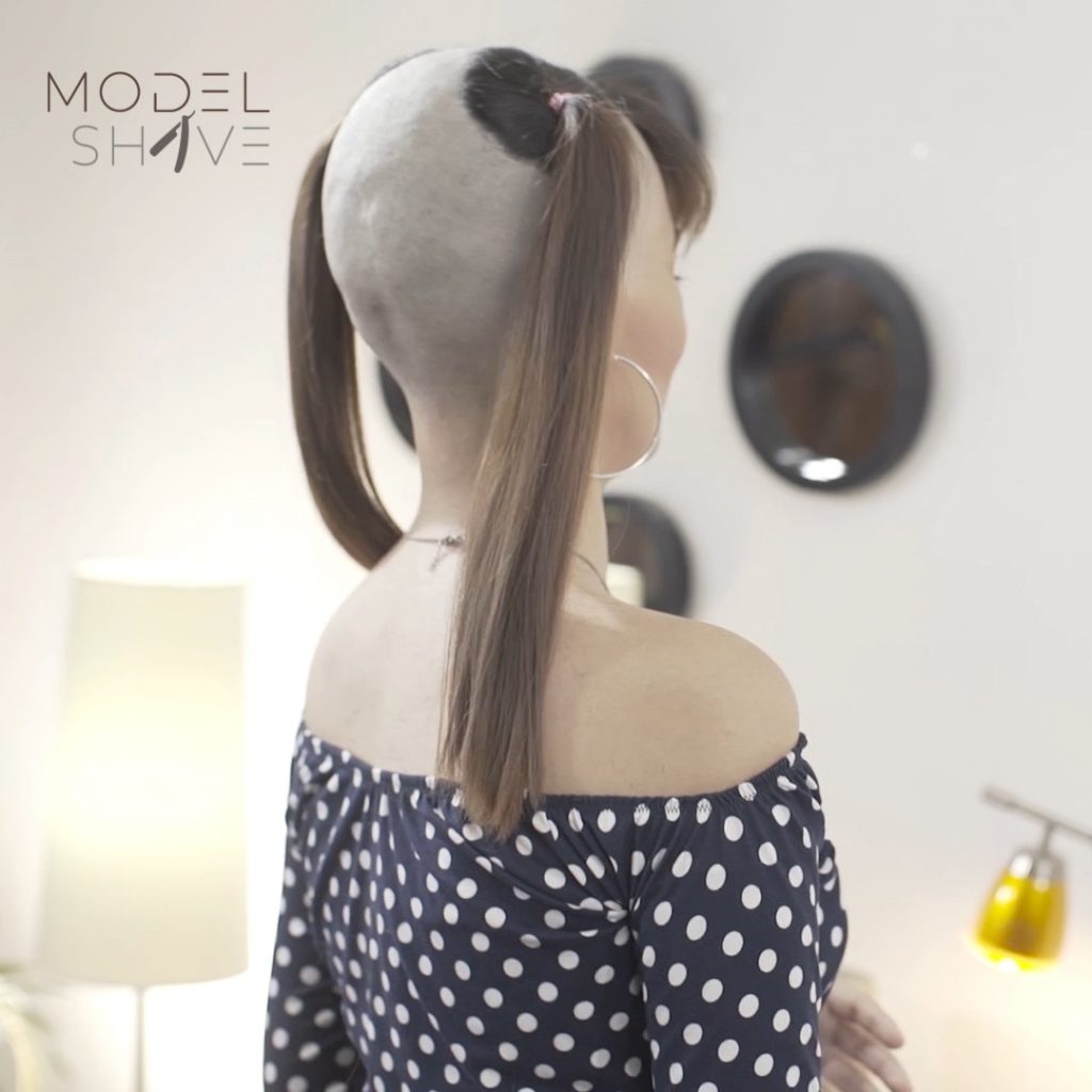 Girl at the hairdresser to get a fresh head shave. - Model Shave