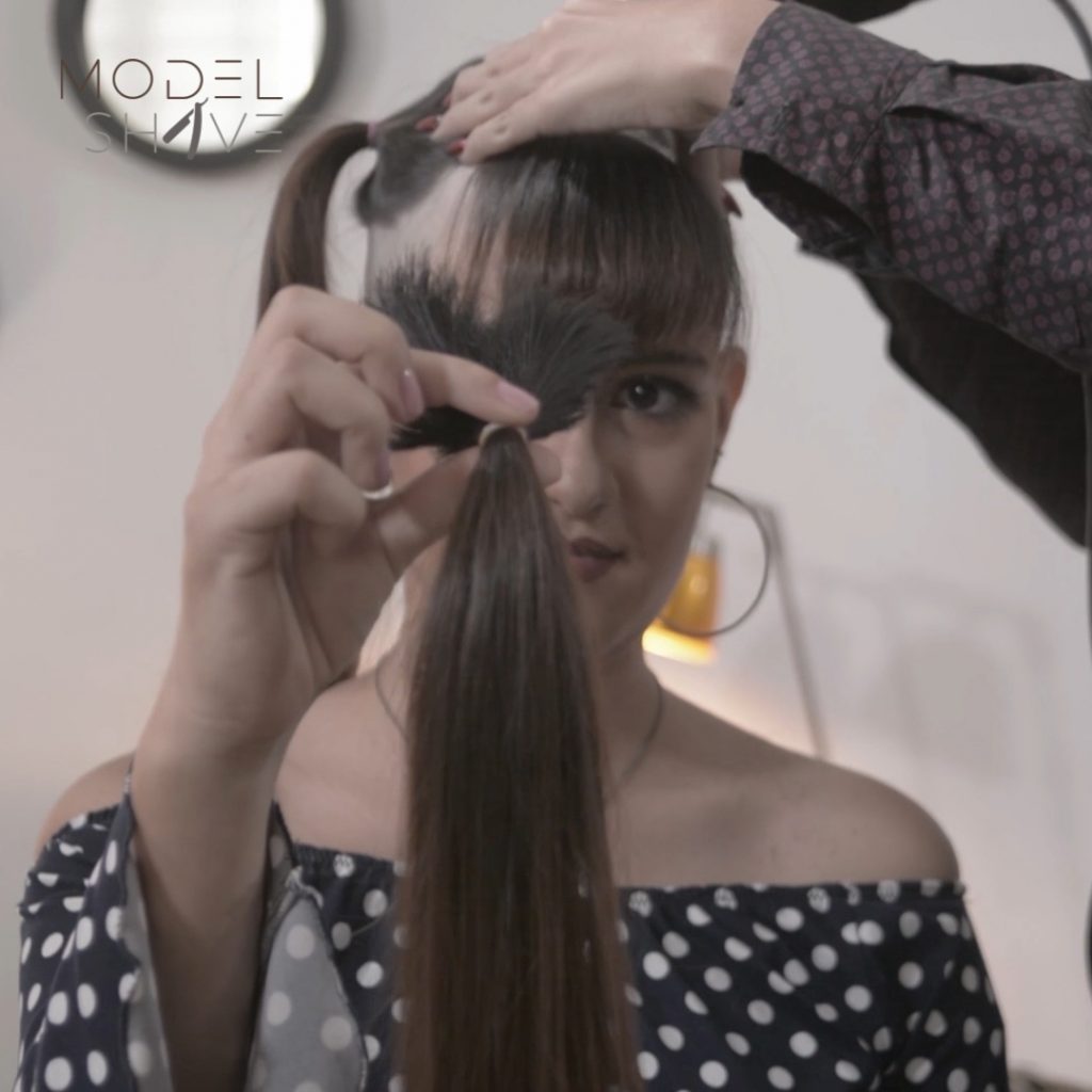Girl at the hairdresser to get a fresh head shave. - Model Shave